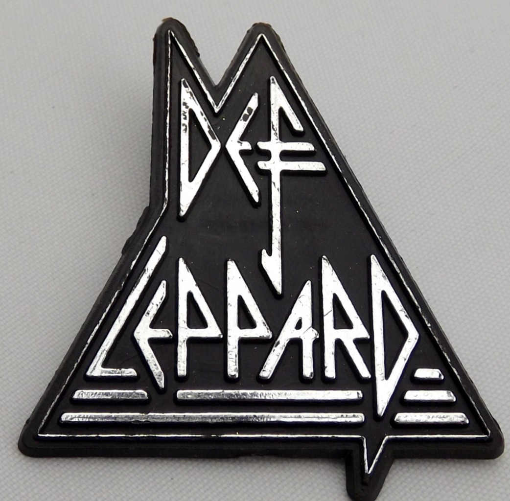 Def Leppard Vintage Silver Logo Shaped Triangular Plastic Pin Badge