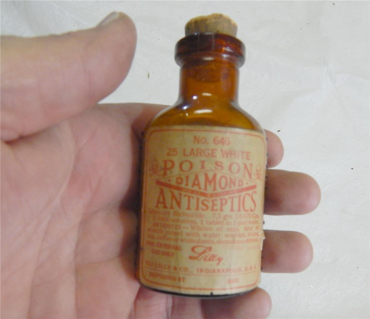 ANTIQUE POISON BOTTLE WITH LABEL